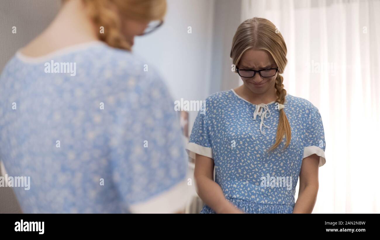 Sad teen girl in old fashioned dress crying, feeling bad of poor ...