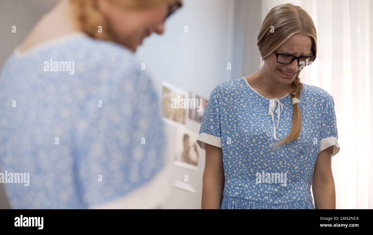 Desperate girl in old fashioned dress crying, feeling bad of poor ...
