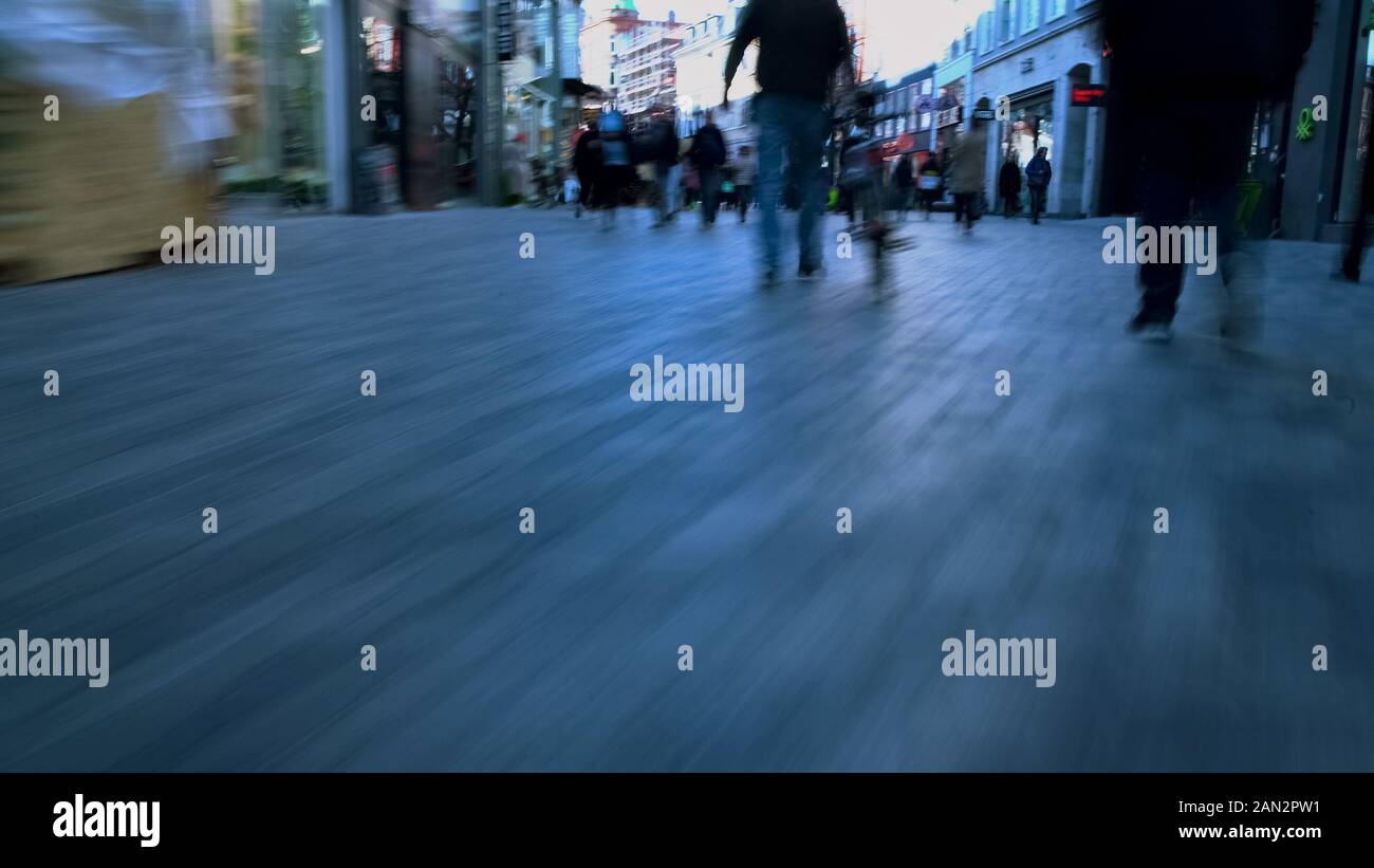 Busy time on pedestrian street, busy people rushing in city center ...