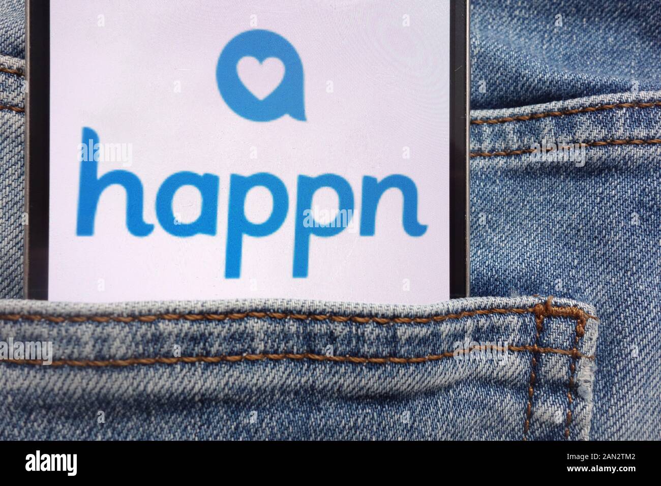 Happn logo displayed on smartphone hidden in jeans pocket Stock Photo ...