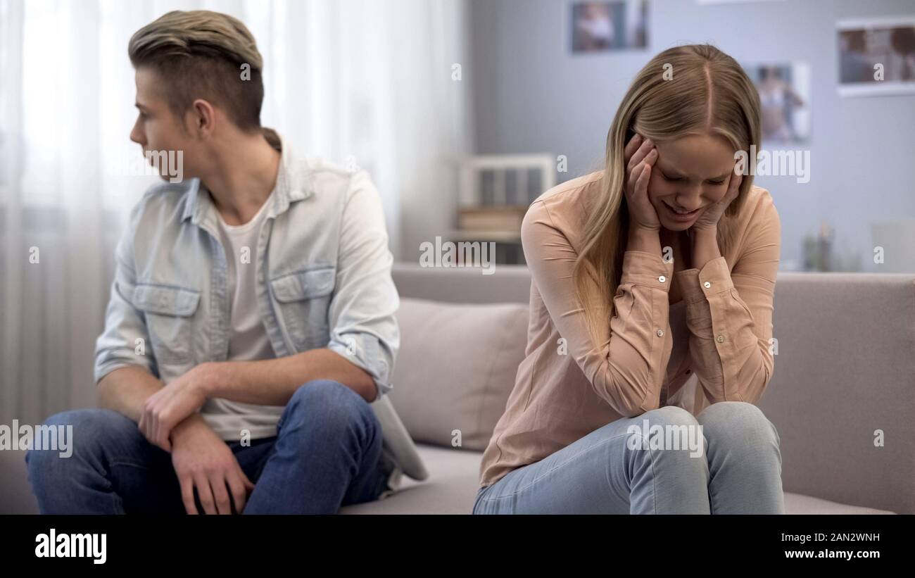 Young couple quarrels, emotional girl crying desperately, crisis in ...