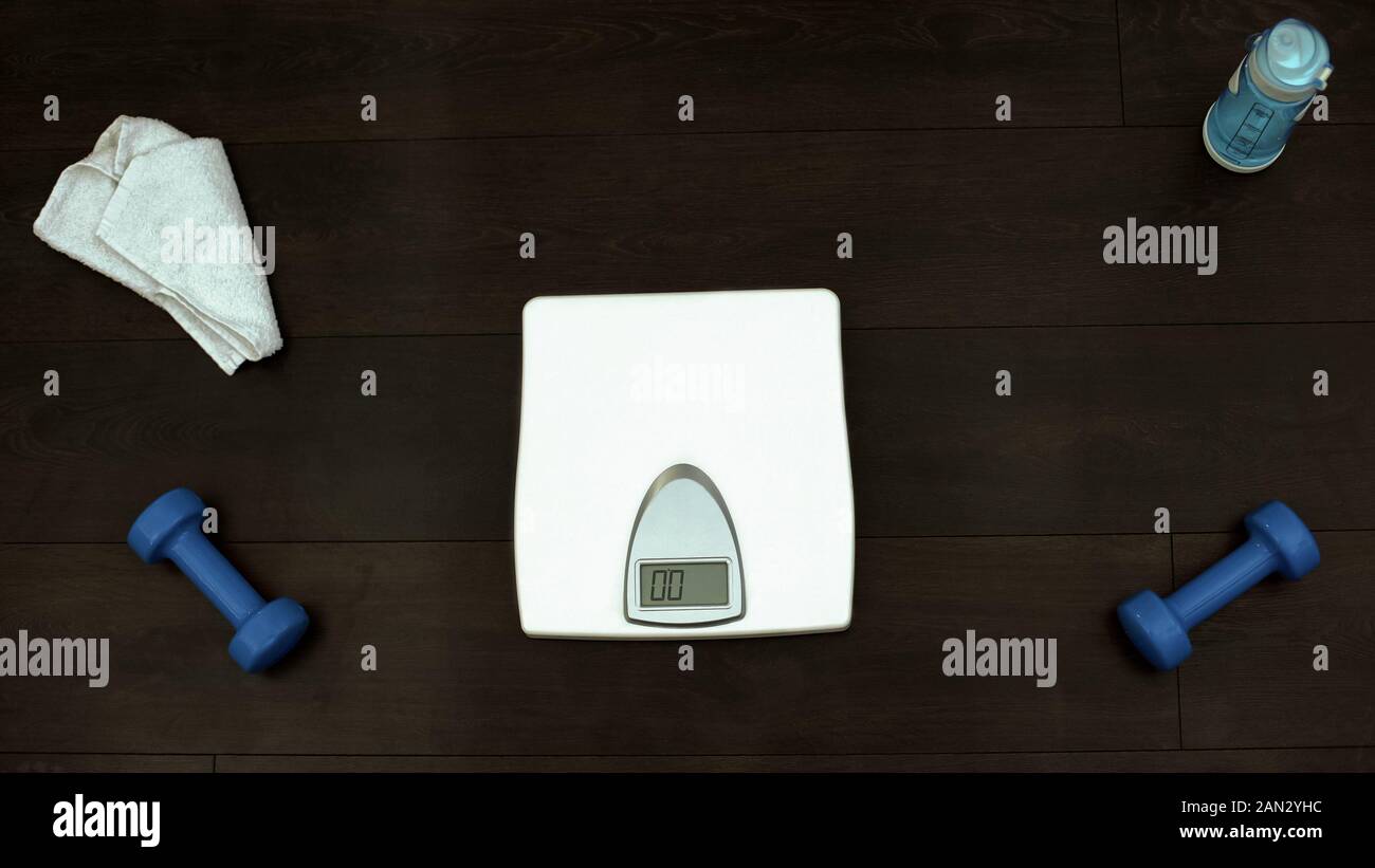 Empty scales standing on floor of gym, weightloss checking, slimming ...