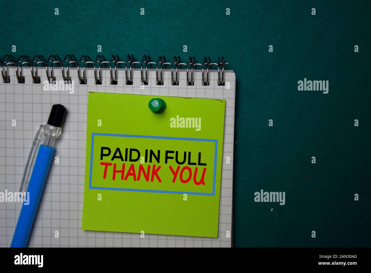 Paid in Full - Thank You write on a sticky note isolated on green ...