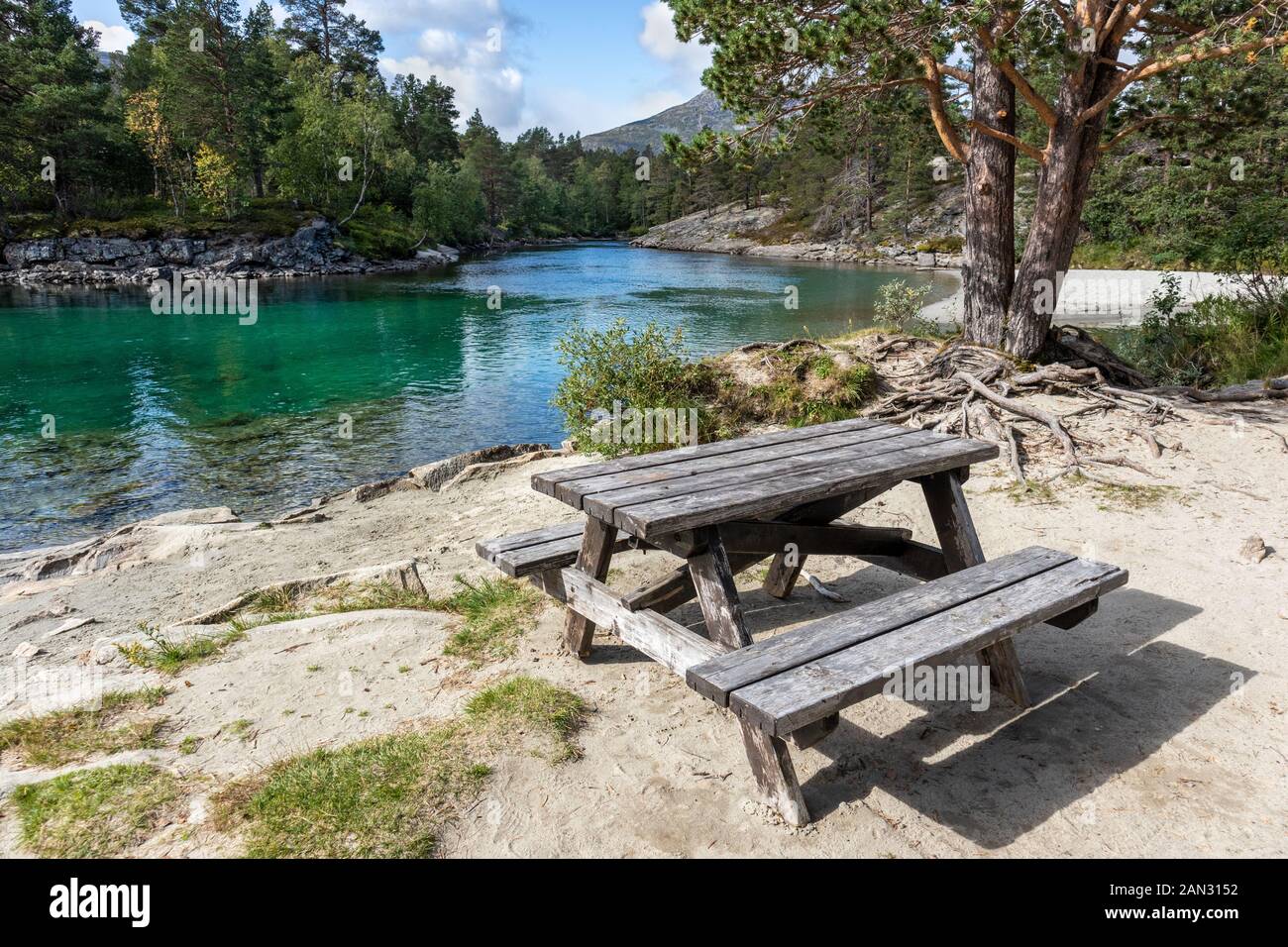 Camping rest area for picnic with wooden table bench on sand by the ...