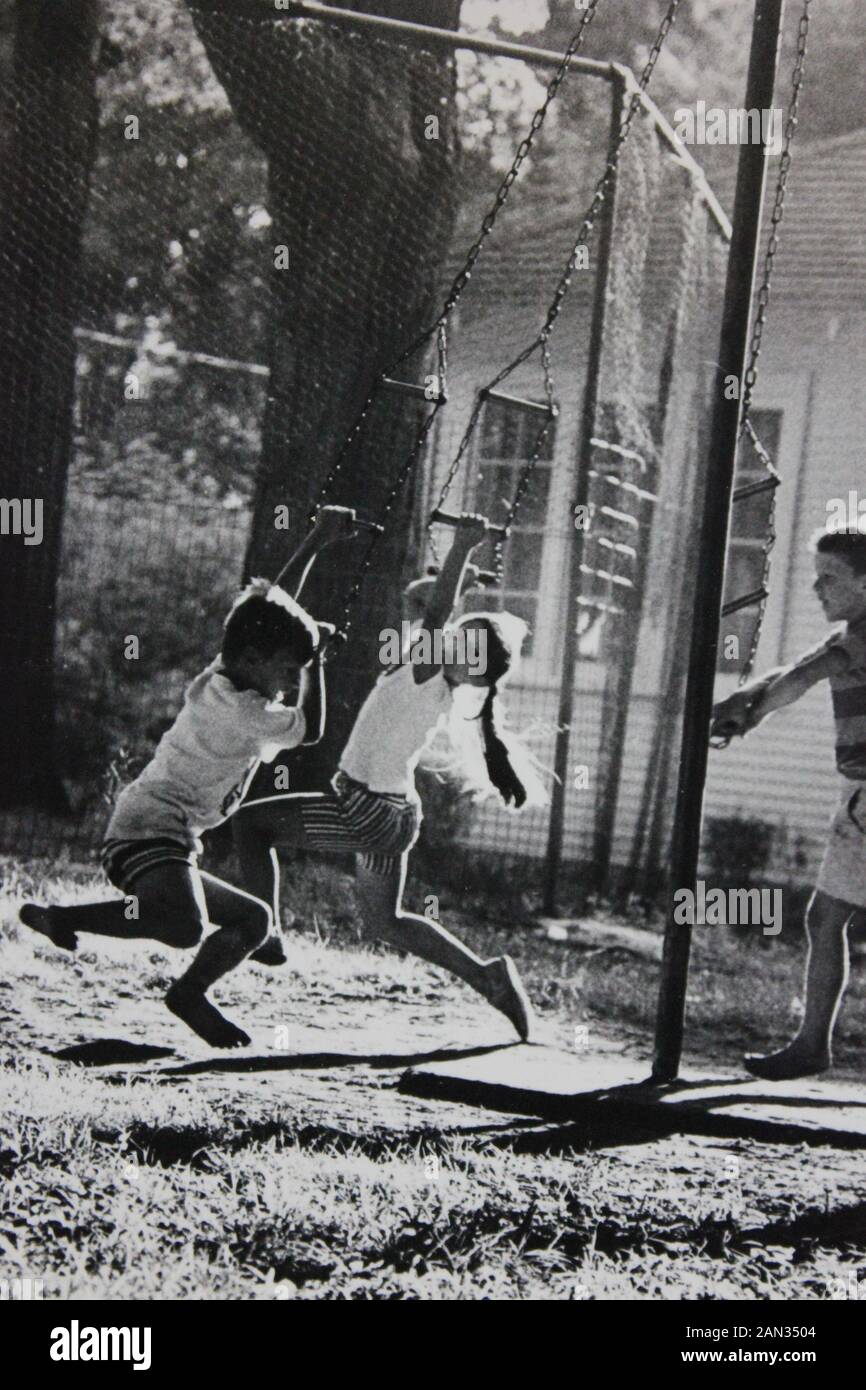 1970s kids playing playground hi-res stock photography and images - Alamy