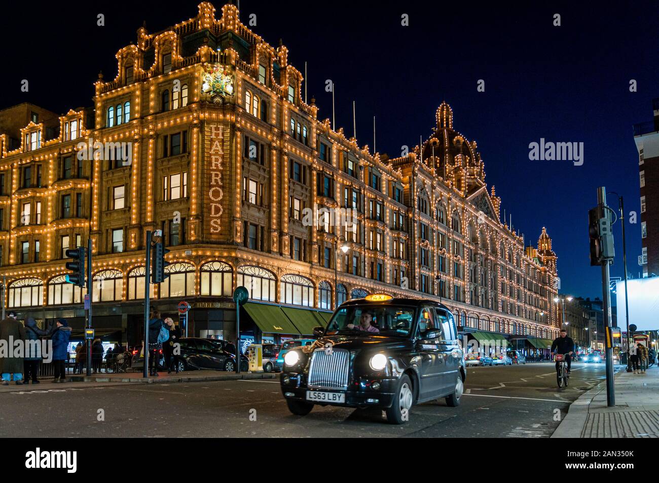 Black Cab outside Harrods at night, London, UK Stock Photo - Alamy