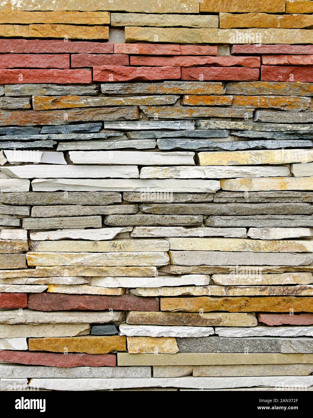 Background image of wall made of colorful stone tiles Stock Photo - Alamy