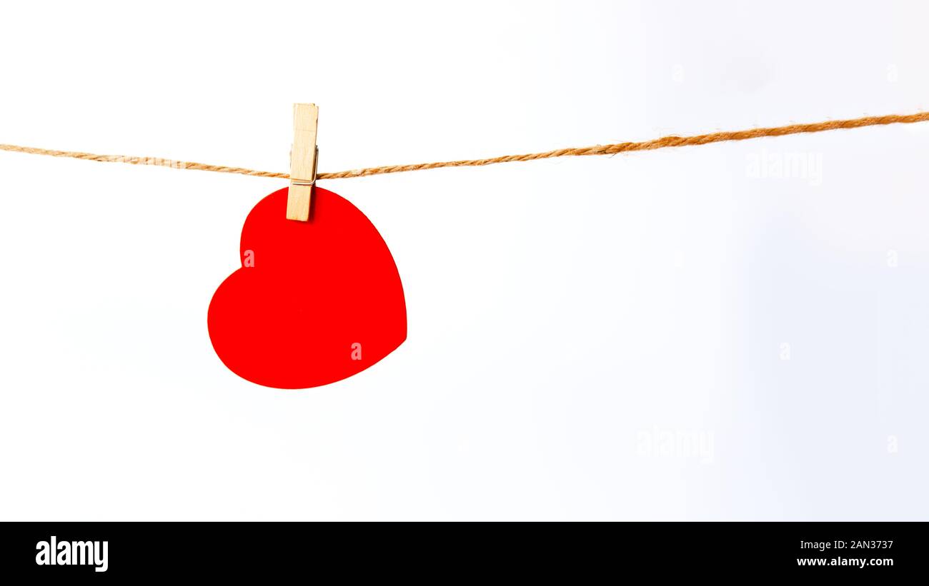 Red heart pinned isolated on white background. Valentine's Day concept ...