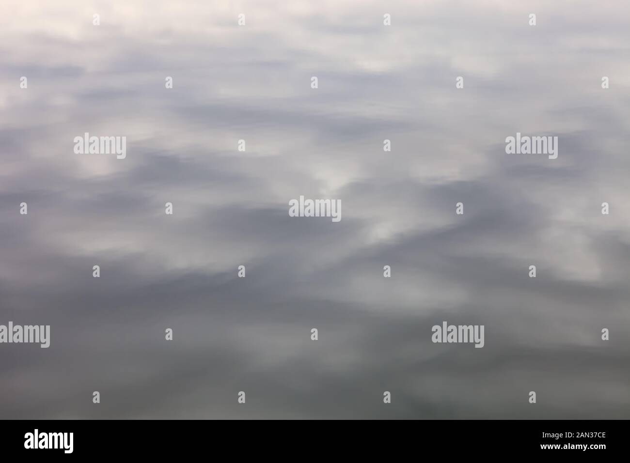 Abstract background - Reflection of cloudy, neutral sky in the water ...