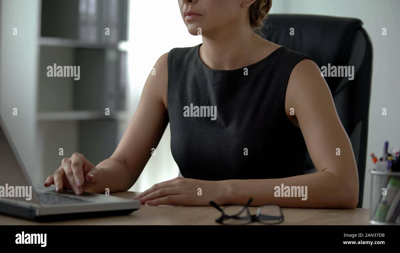 Lady boss working on computer in office, reading important e-mail ...