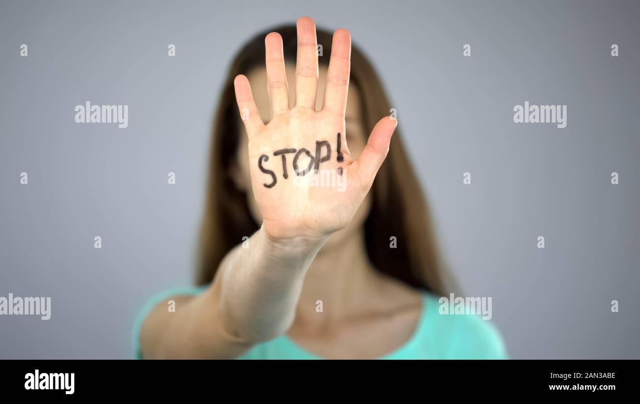 Stop sign on womans hands, female rights protection, awareness of ...