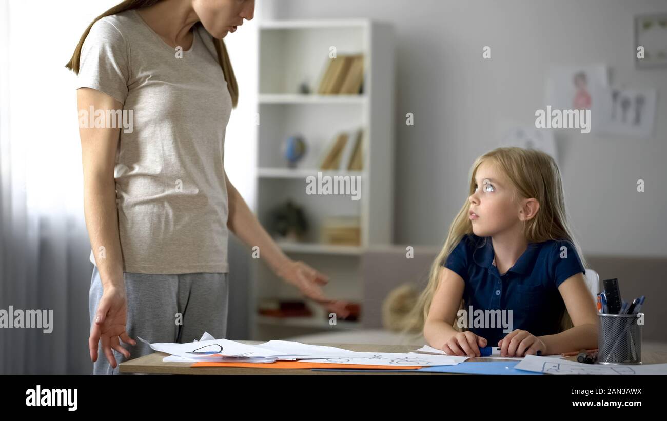 Angry mother criticizing and screaming at little daughter, family ...