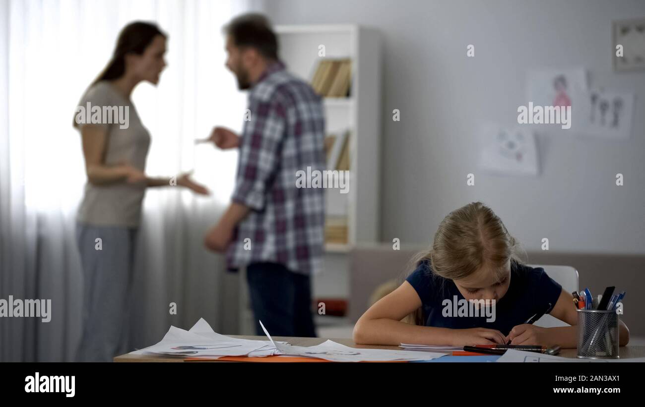 Child growing in conflicts and aggression, parents fighting at home ...