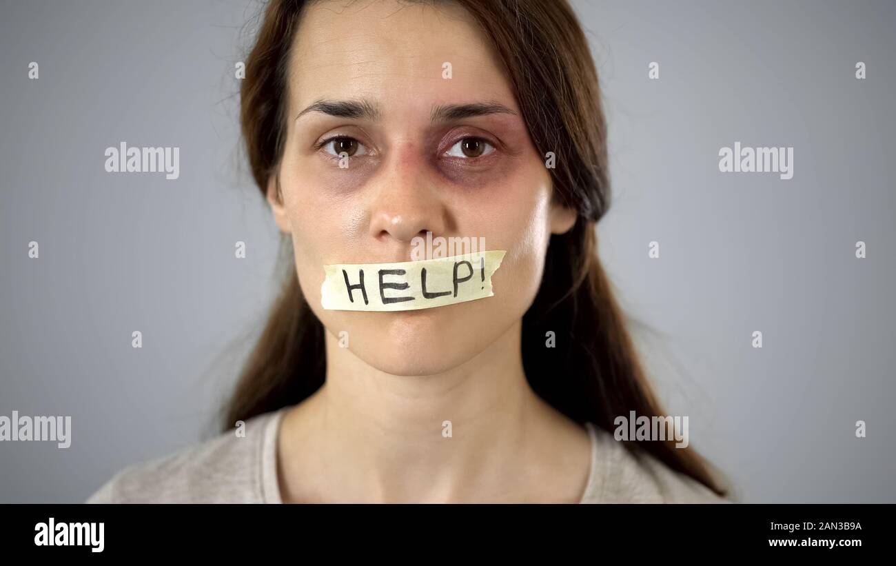 Help tape on womans mouth, silent request for help and protection ...