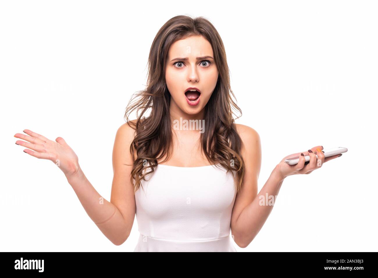 Surprised happy young woman looking sideways in excitement over white ...