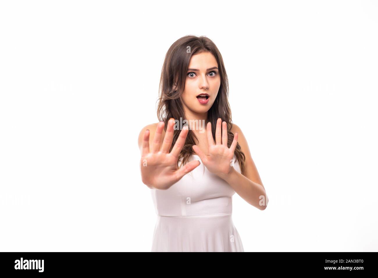 Portrait of girl showing hand to camera on white background Stock Photo ...