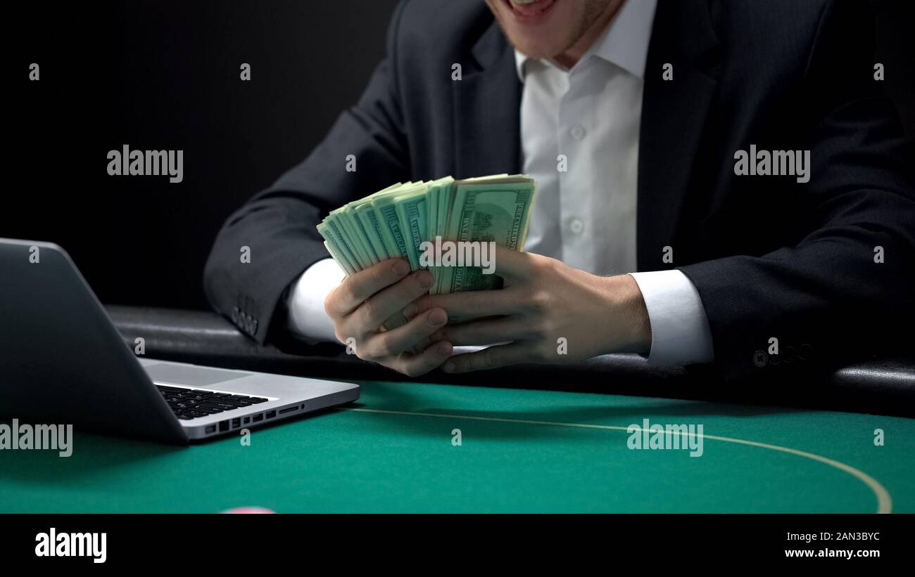 Excited business man receiving money hi-res stock photography and ...