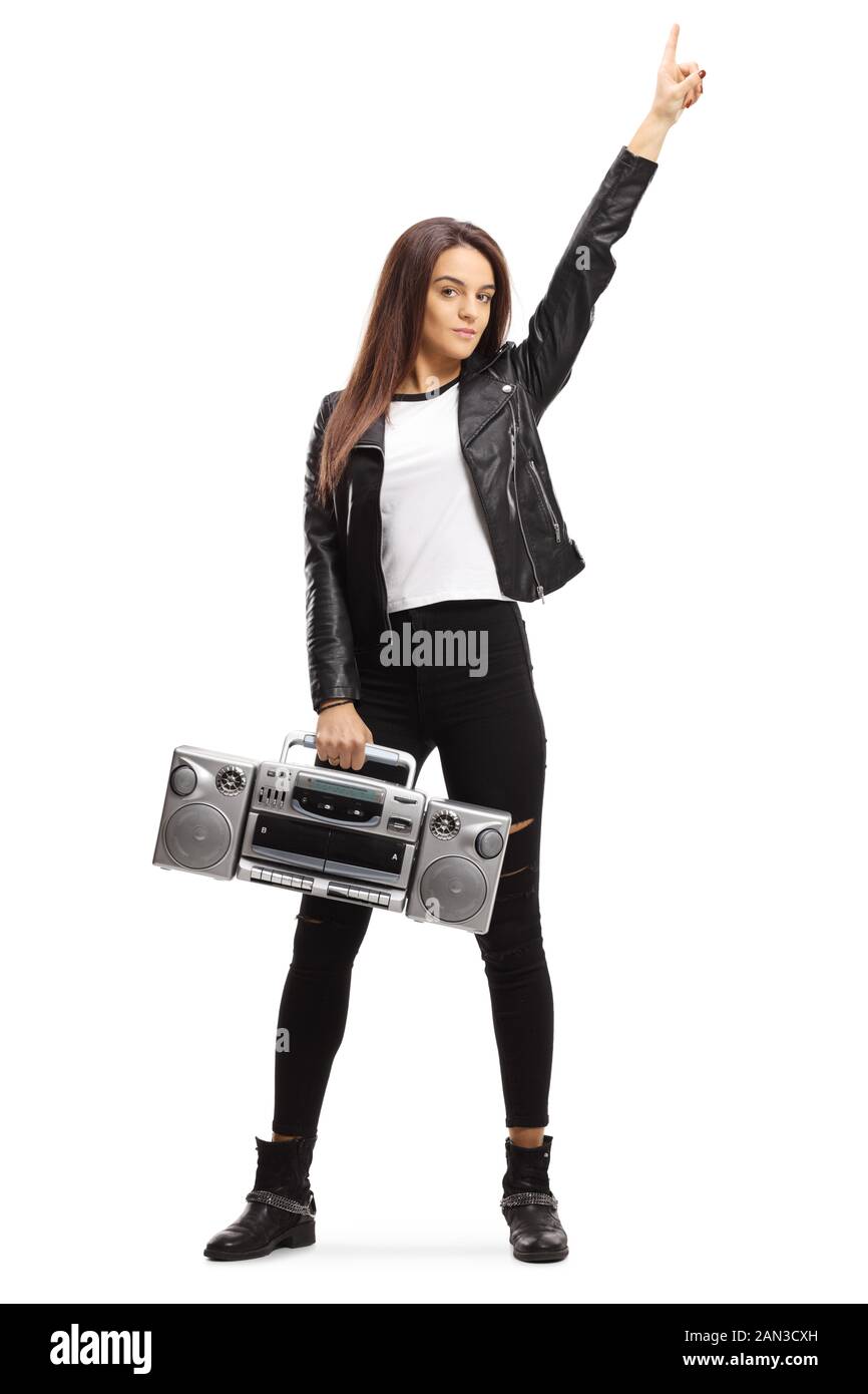 Full length portrait of a young woman holding a boombox radio and ...