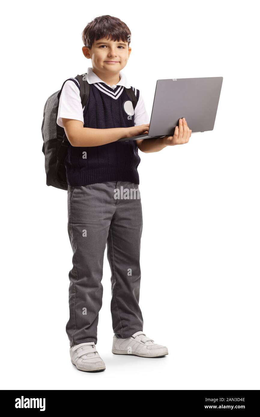 Full length portrait of a schoolboy in a uniform holding a laptop ...