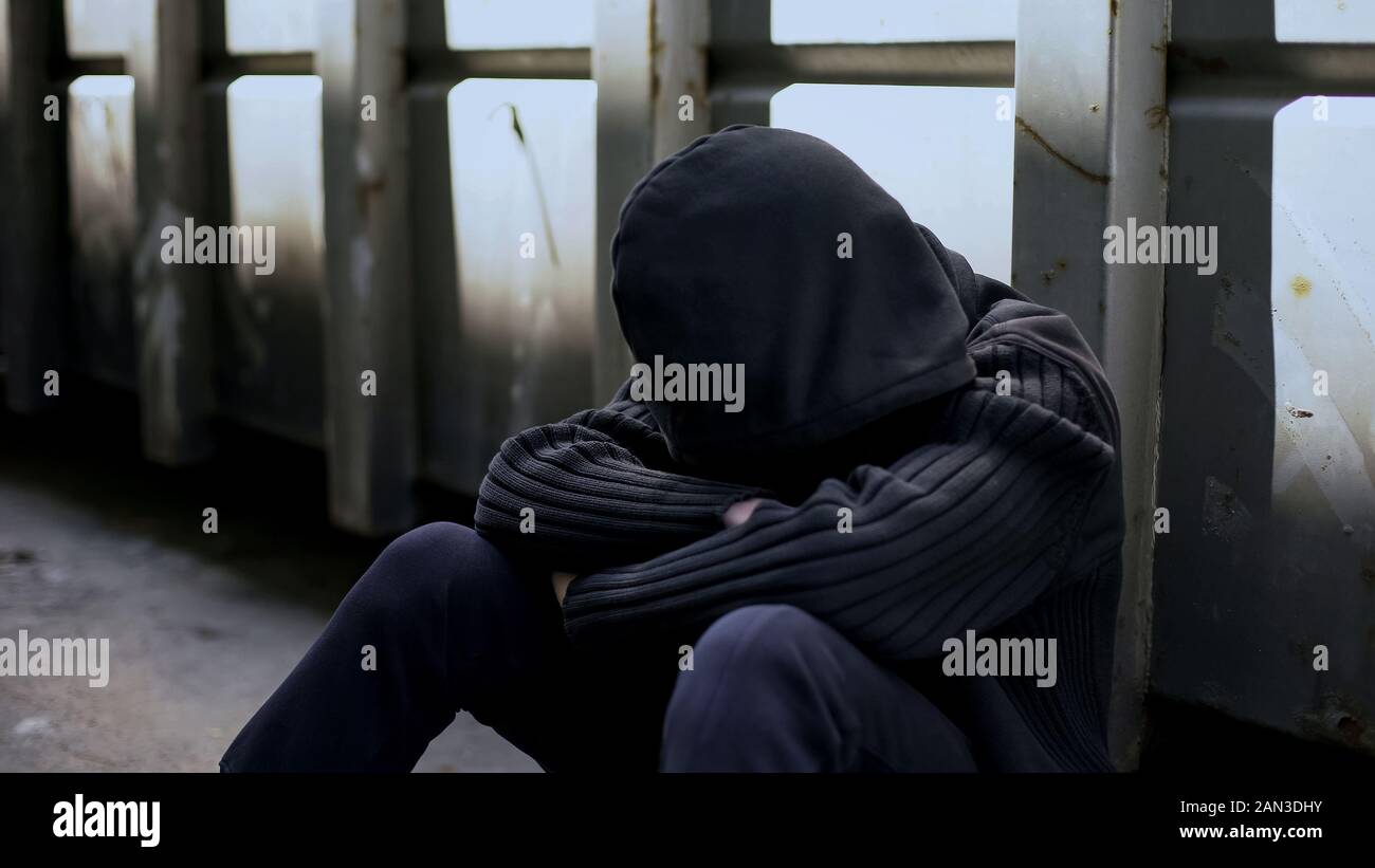 Depressed teenager boy feeling hopelessness, regretting wrong decisions ...