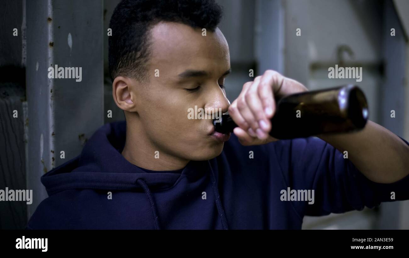 Guy drinking beer trying to calm down inner pain and depression ...