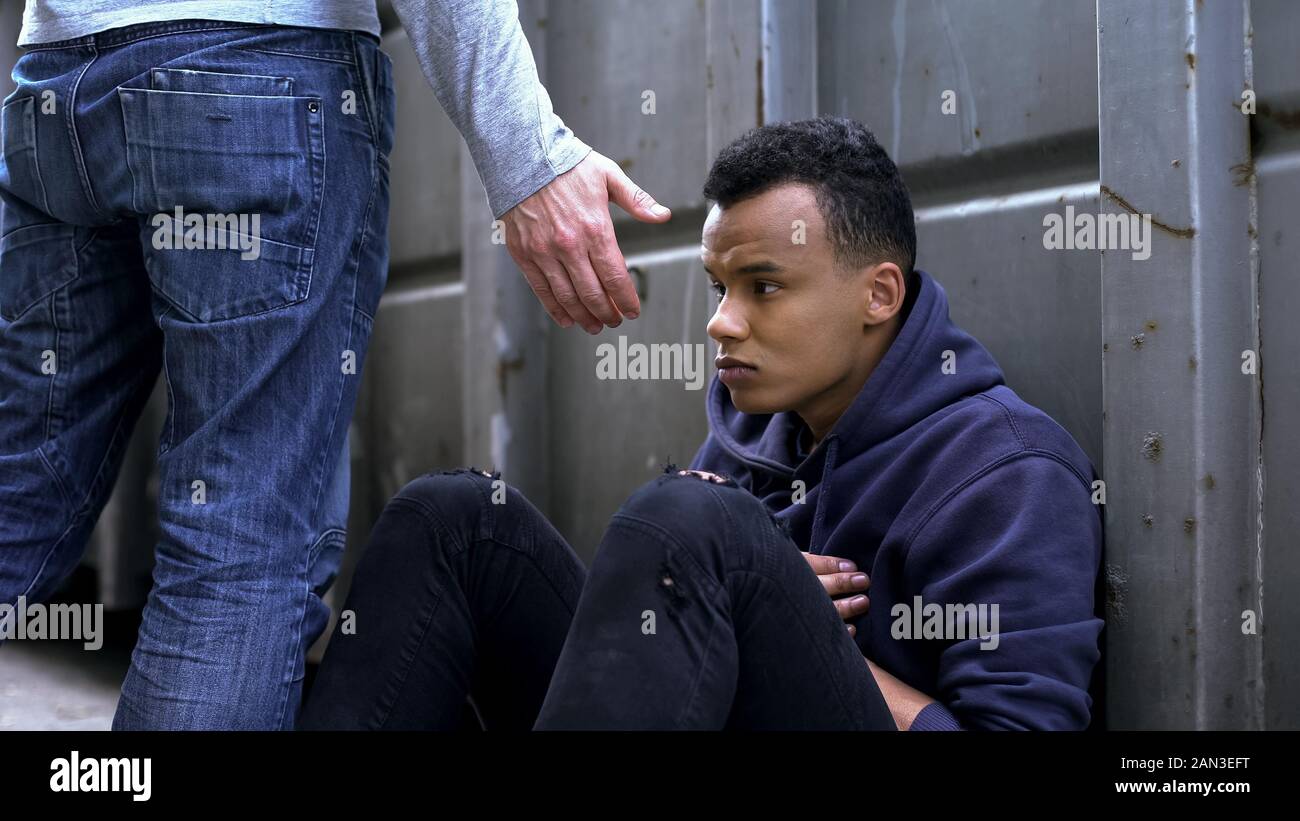 Person helping beggar hi-res stock photography and images - Alamy