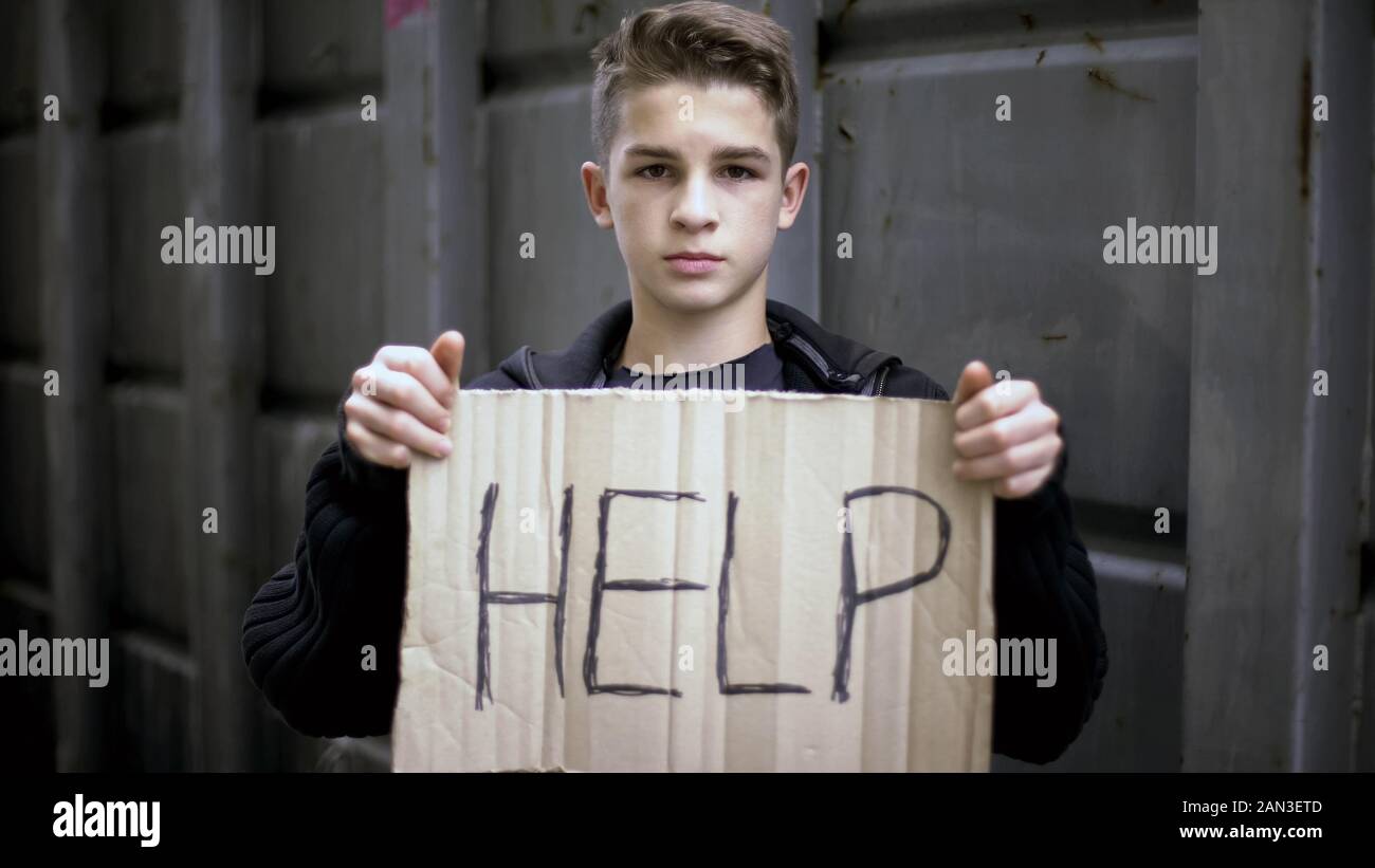 Help sign in homeless orphan hands, child begging help, needs social ...