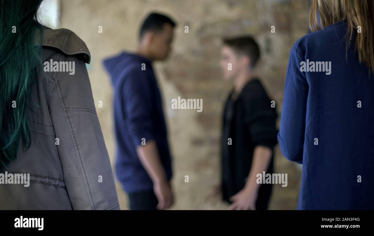 Teenage conflict, two boys fighting for girl, street violence, self ...