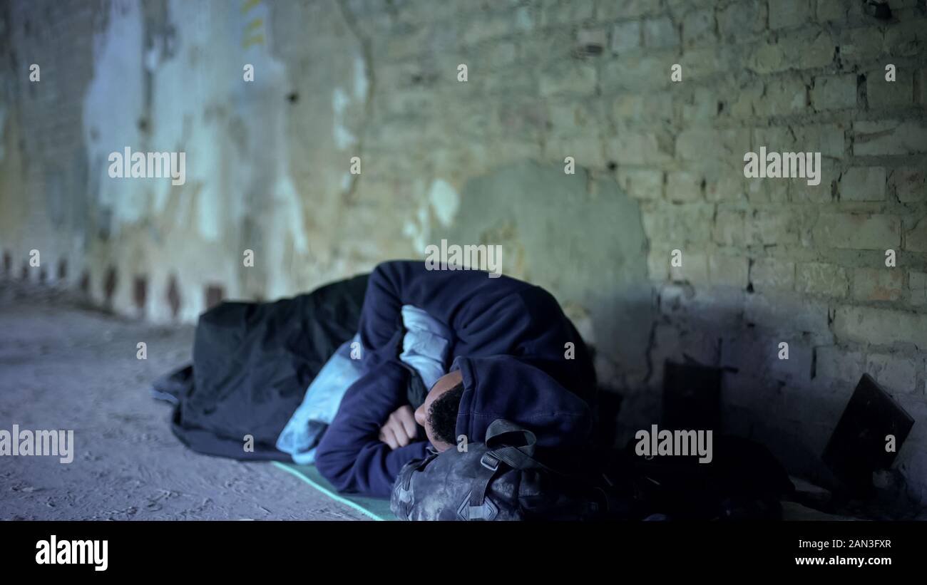 Homeless teen sleeping street hi-res stock photography and images - Alamy
