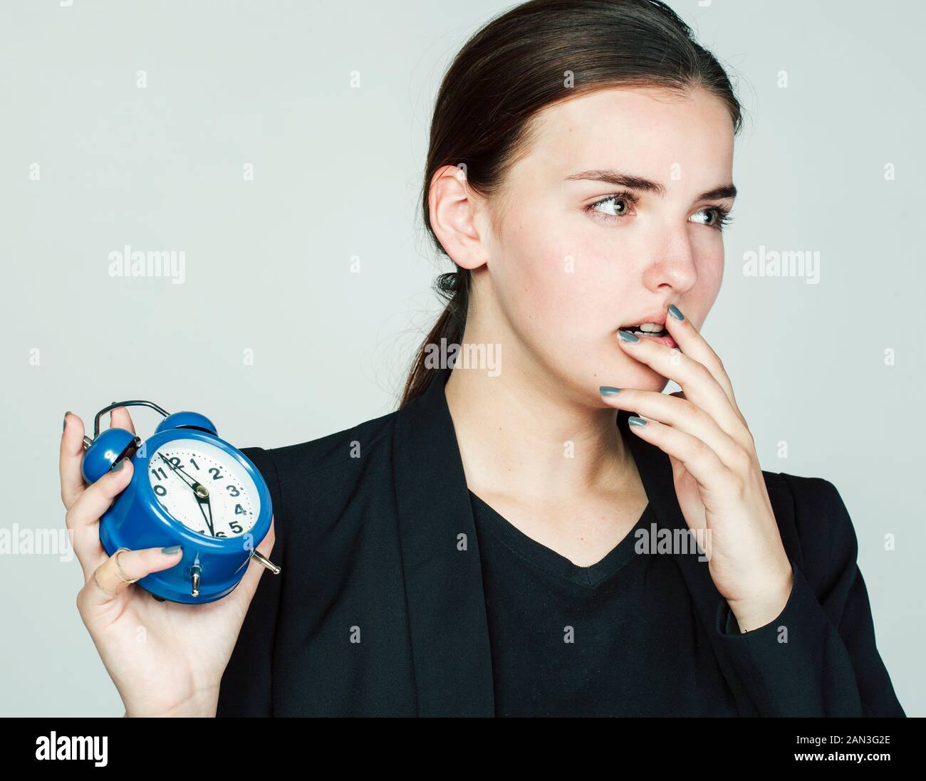 young beauty woman in business style costume waking up for work early ...