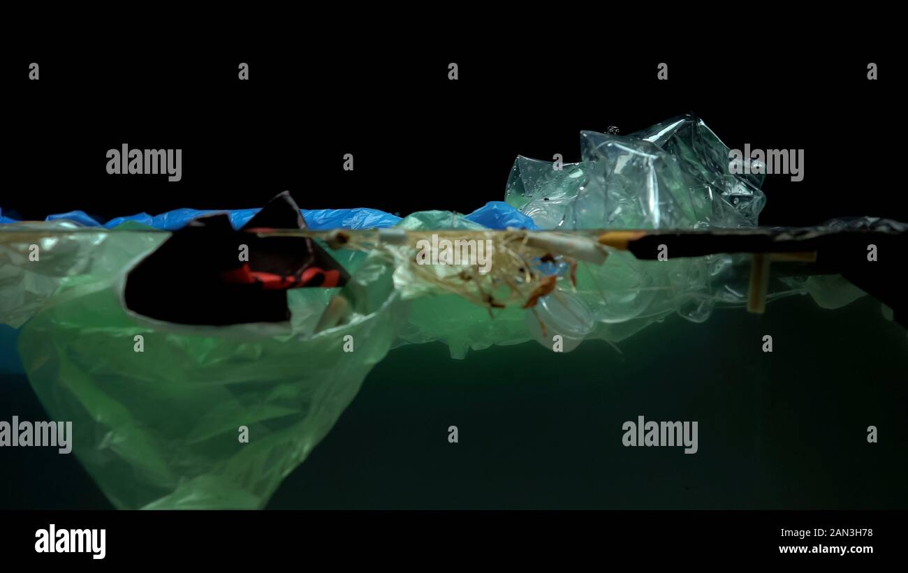 Toxic water full of garbage, polluted area, ecological situation, macro ...