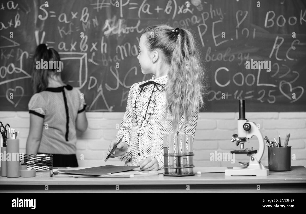 Little girls in lab. Microscope. Biology lesson. Back to school ...