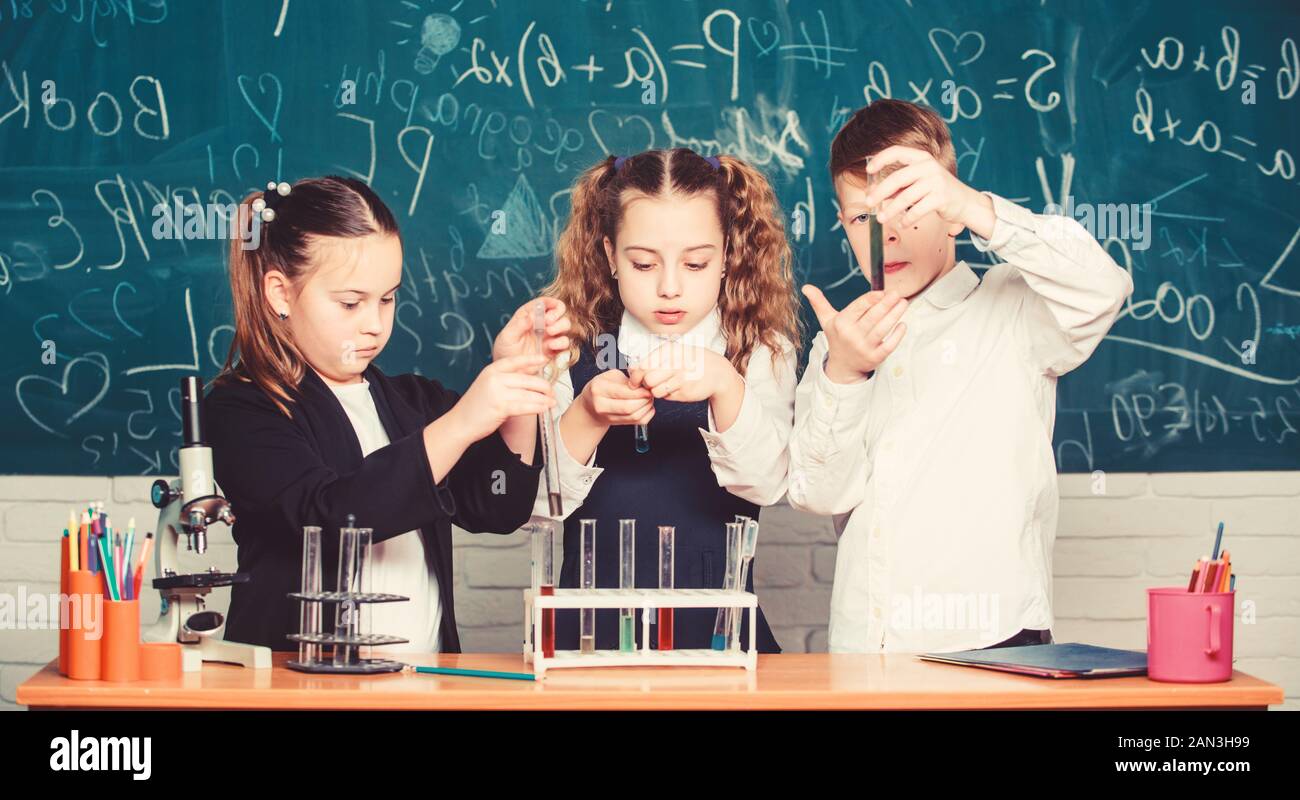 Happy children. Biology lesson. Little kids learning chemistry in lab ...