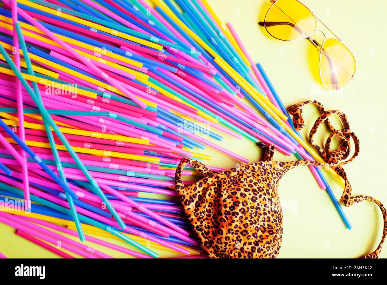 summer stuff on yellow background close up top view Stock Photo - Alamy