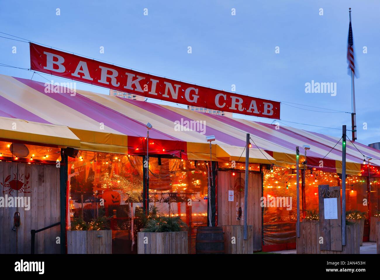 The Barking Crab restaurant before sunrise. The restaurant is lively ...