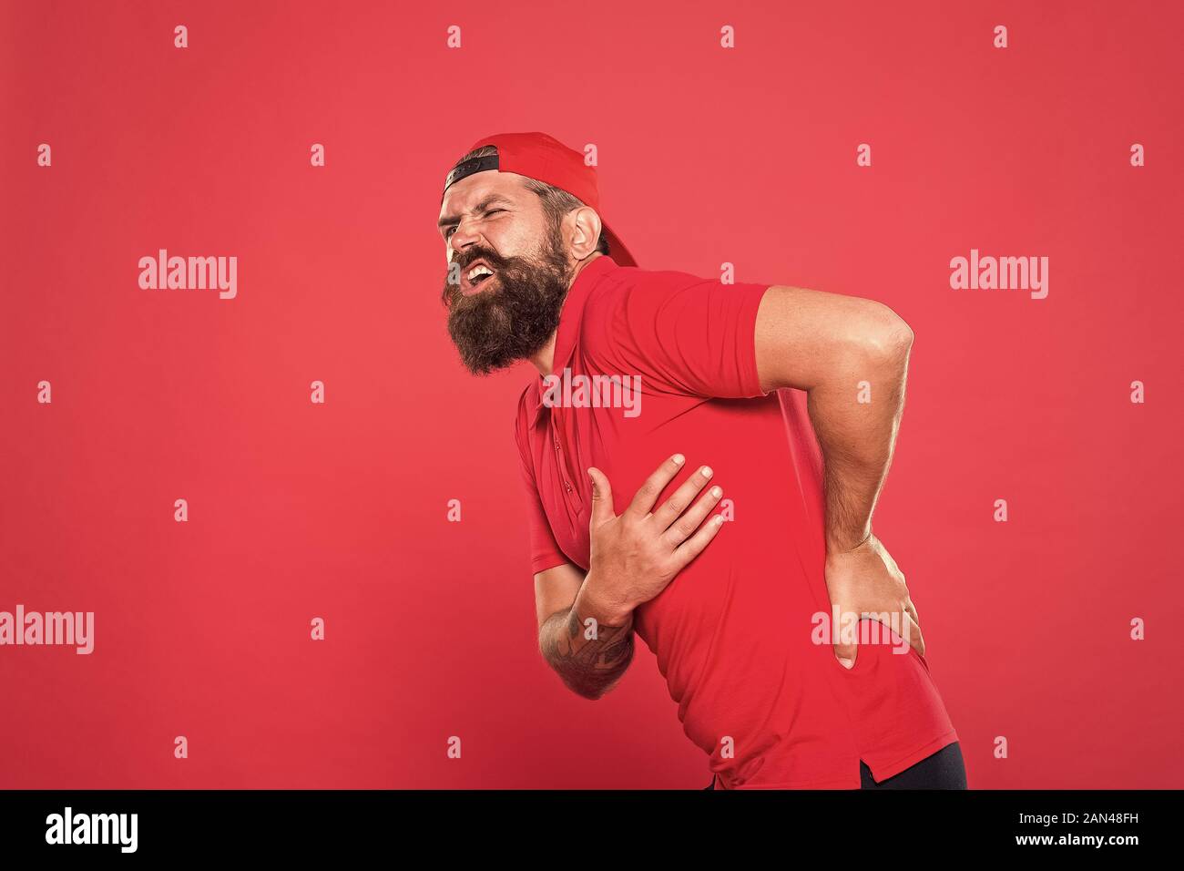 My back hurts. bearded man pain in back. barista tired and back pain ...