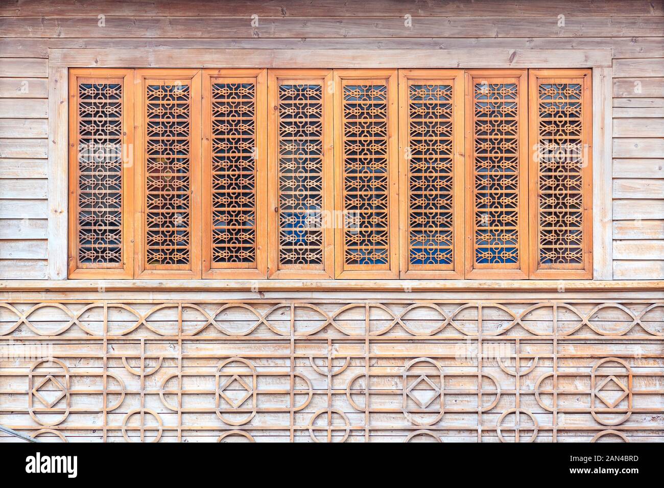 The traditional wooden wall with lattice windows,which has the style of ...