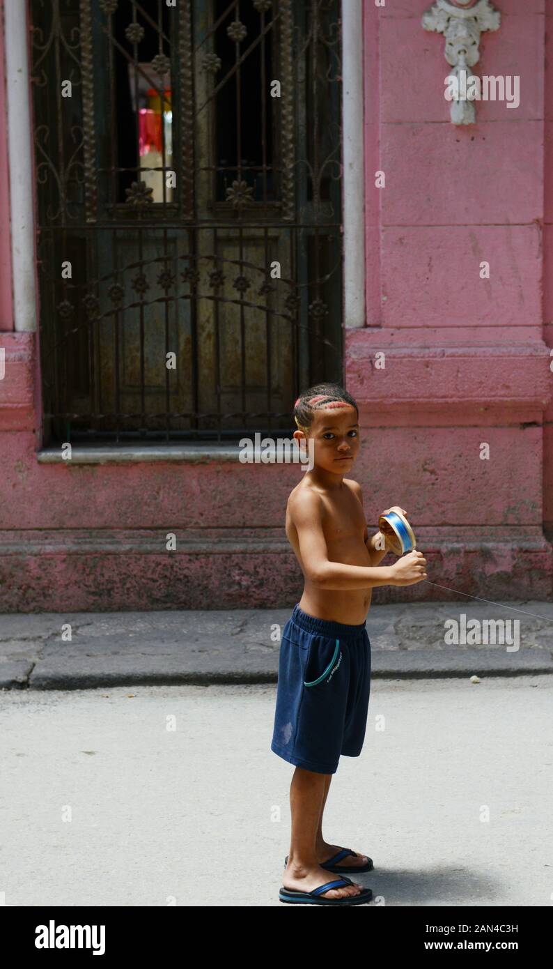 A Cuban boy playing in the streets of Old Havana, Cuba Stock Photo - Alamy