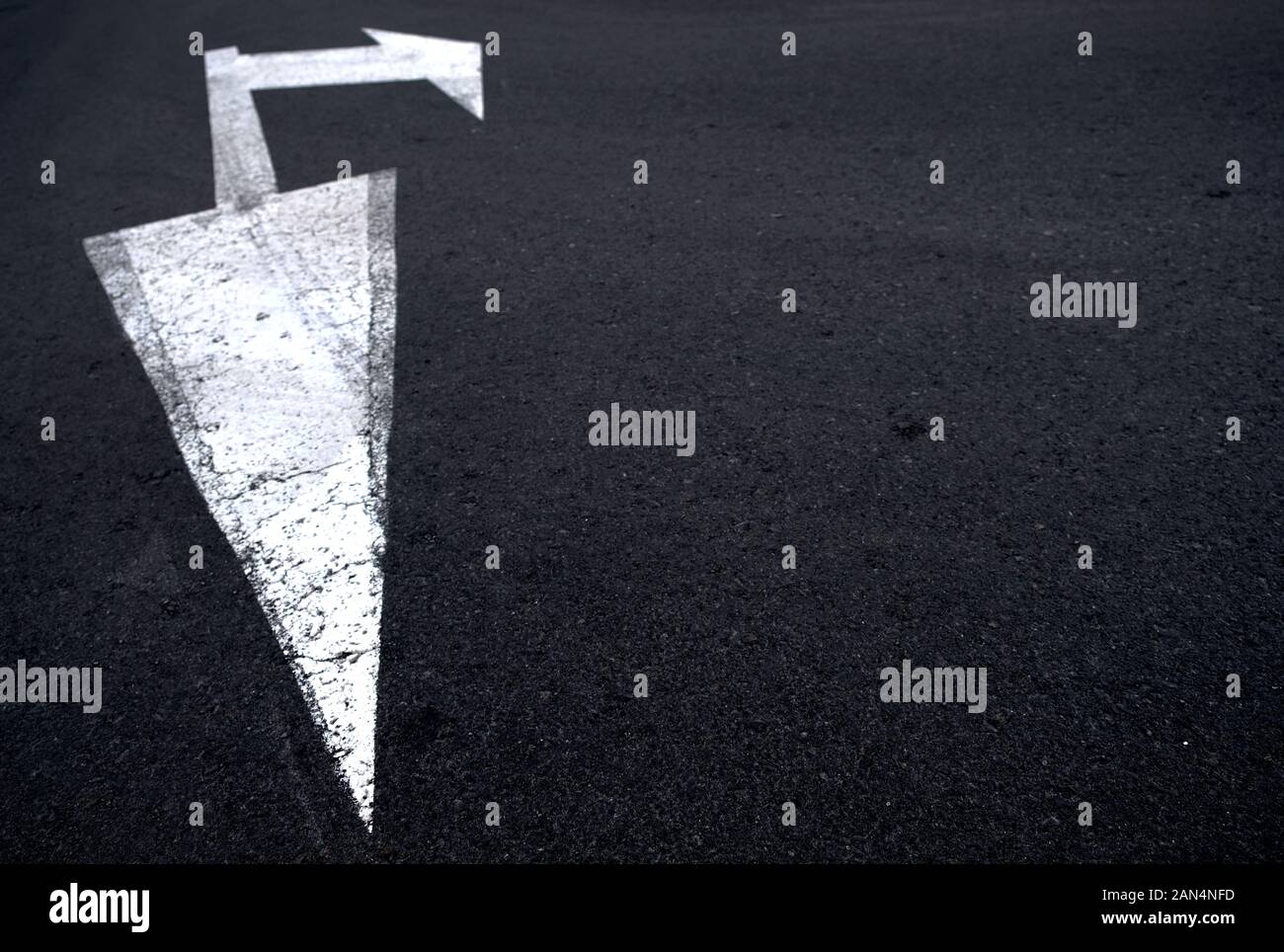 White arrows on black background, road marking and signage Stock Photo ...