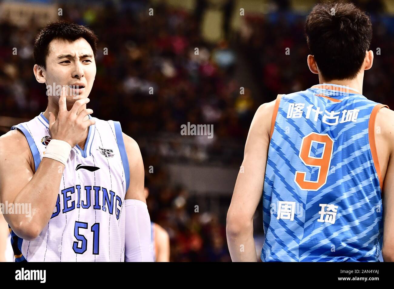 --FILE--Ji Zhe of Beijing Duck, left, reacts during a CBA game against ...