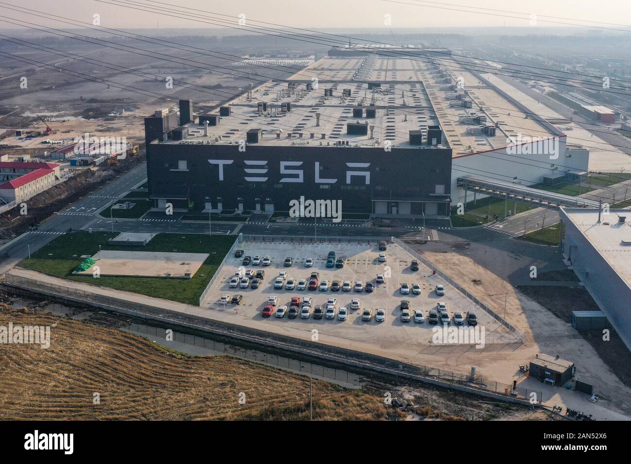 An aerial view of over 200 Tesla Model 3 arrayed in Tesla Gigafactory 3 ...