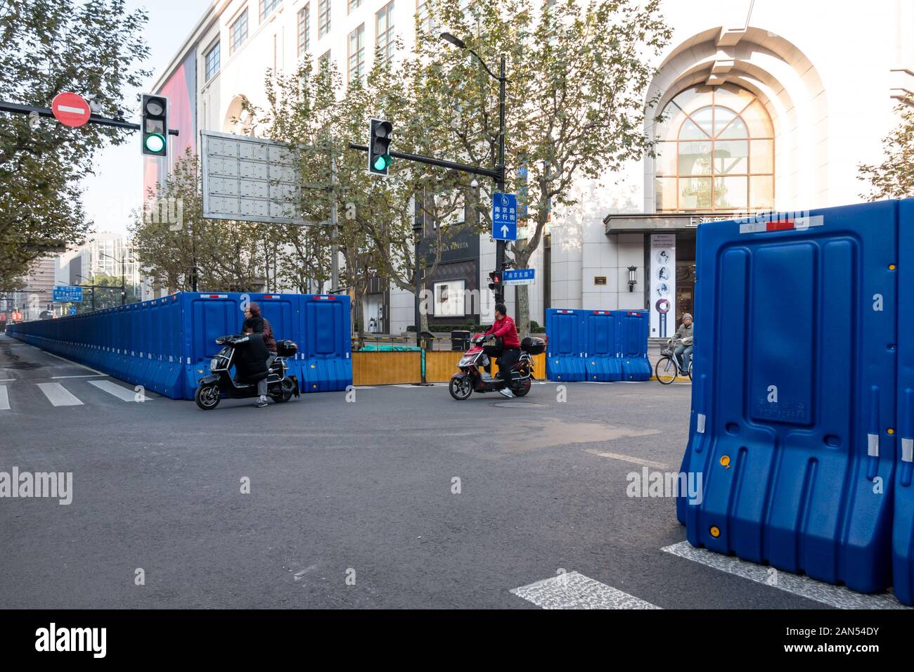 Signs and roadblocks are deployed to stop traffic near Nanjing Road as ...
