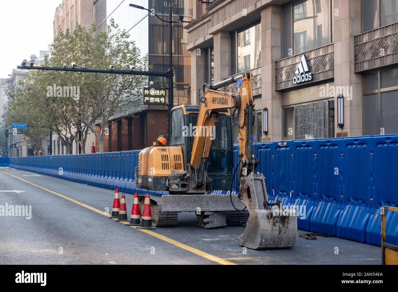 Signs and roadblocks are deployed to stop traffic near Nanjing Road as ...