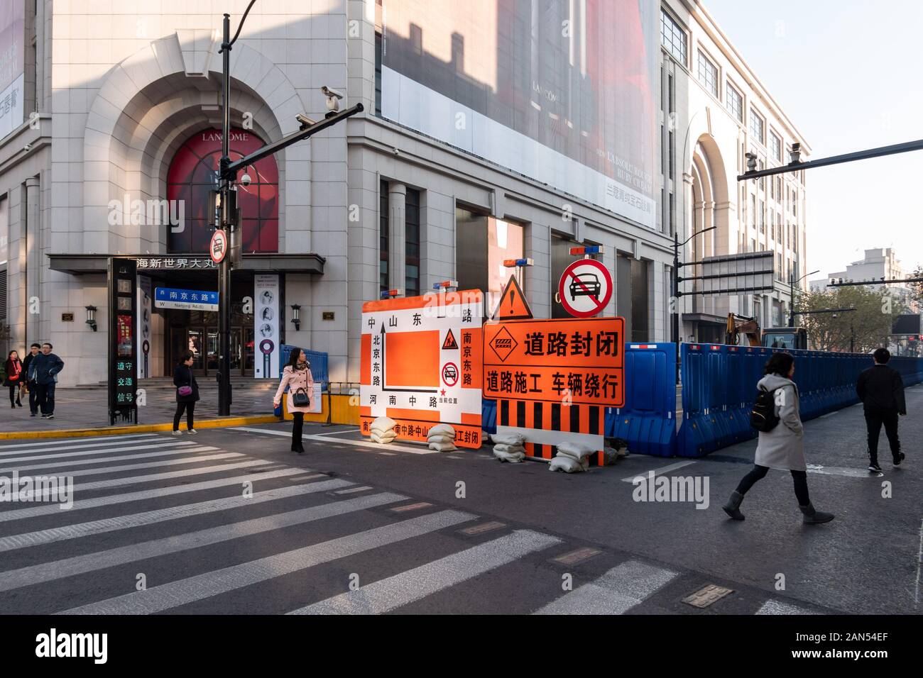 Signs and roadblocks are deployed to stop traffic near Nanjing Road as ...