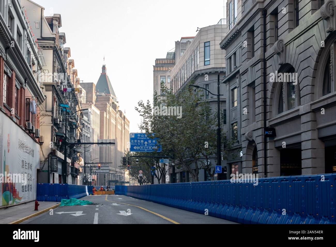 Signs and roadblocks are deployed to stop traffic near Nanjing Road as ...