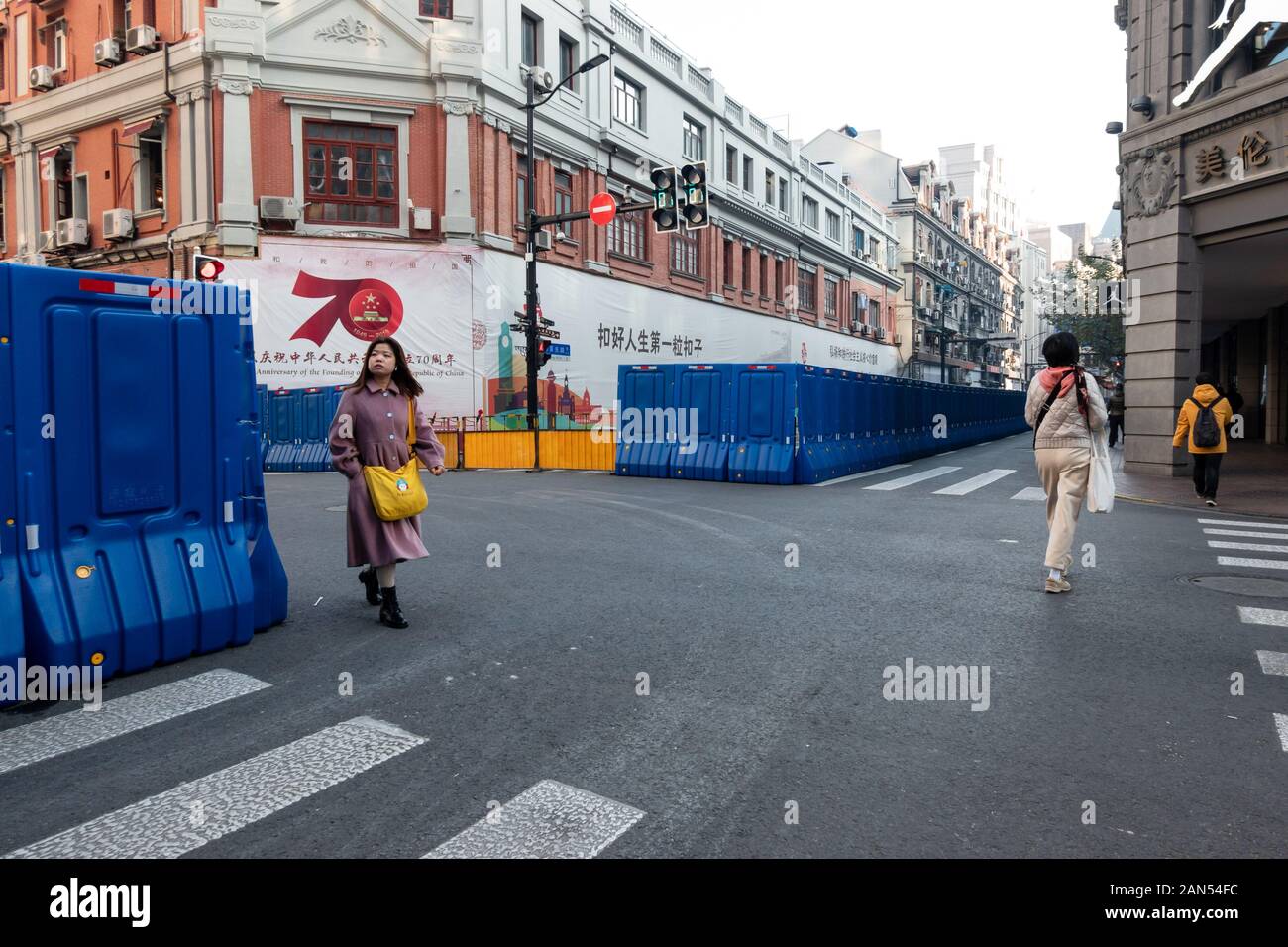 Signs and roadblocks are deployed to stop traffic near Nanjing Road as ...