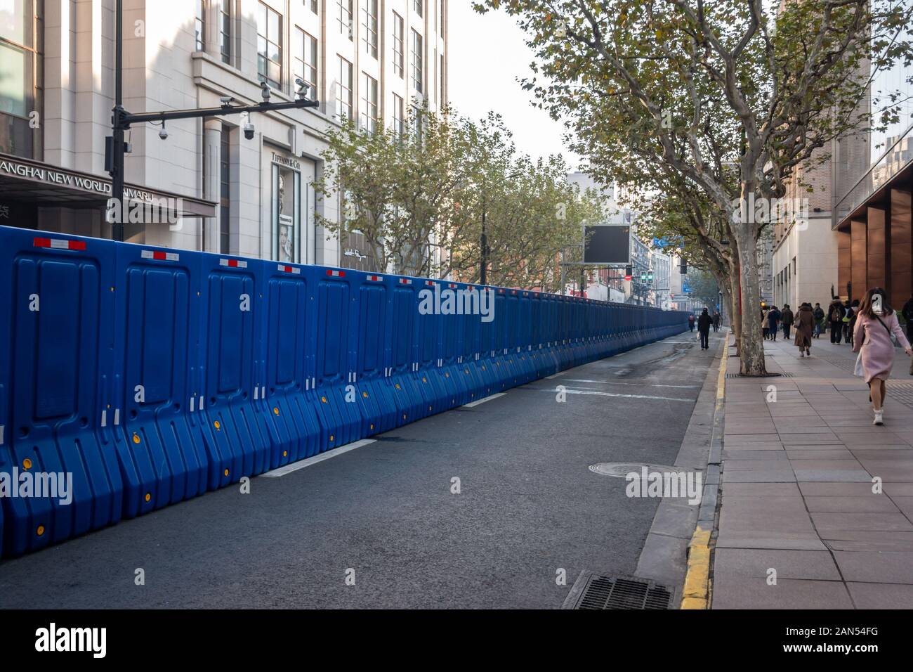 Signs and roadblocks are deployed to stop traffic near Nanjing Road as ...