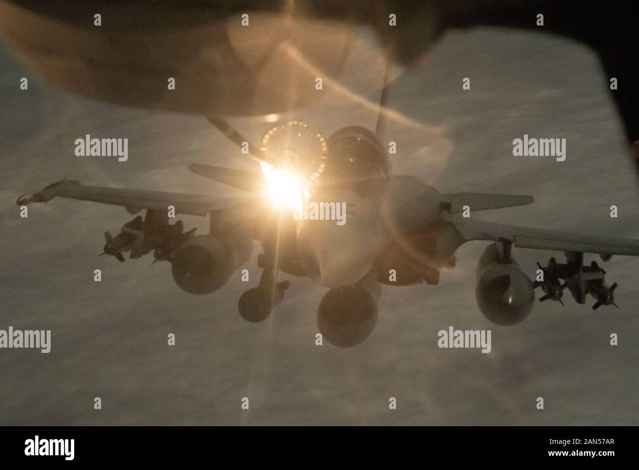 A French Rafale conducts nighttime air refueling with a U.S. Air Force ...