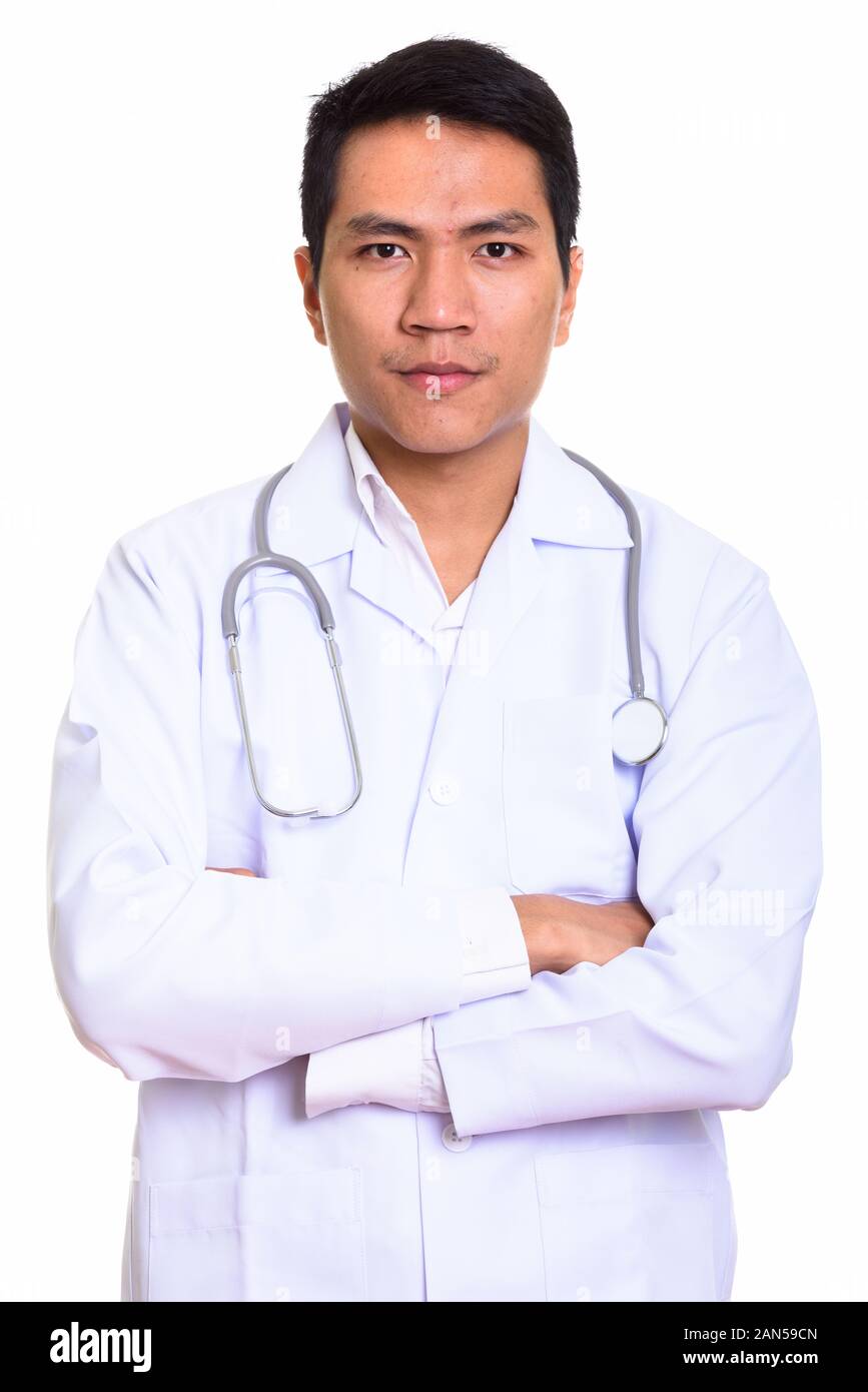 Studio shot of young Asian doctor standing with arms crossed Stock ...