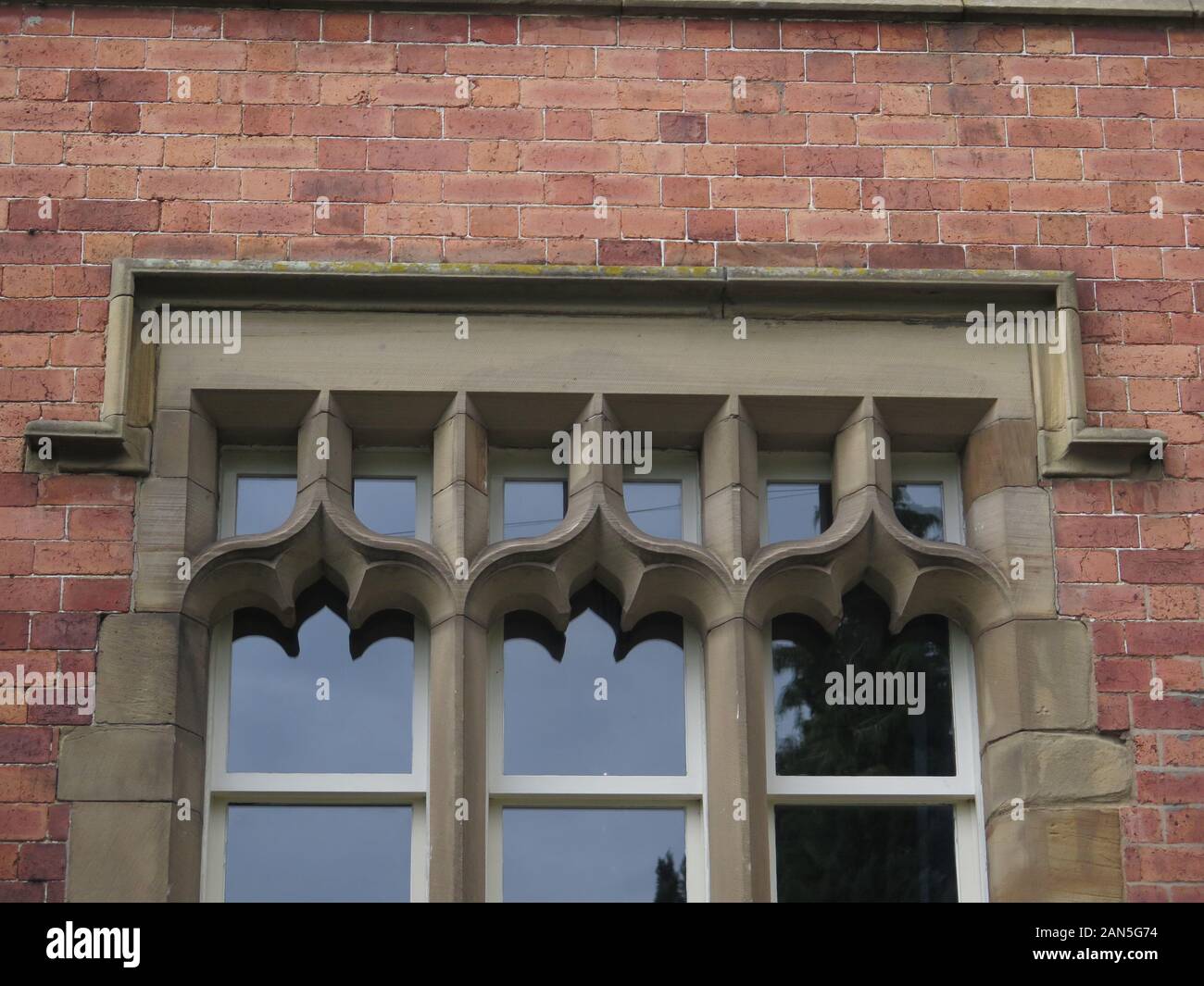 Brick surround decorative window design in English rural village house ...